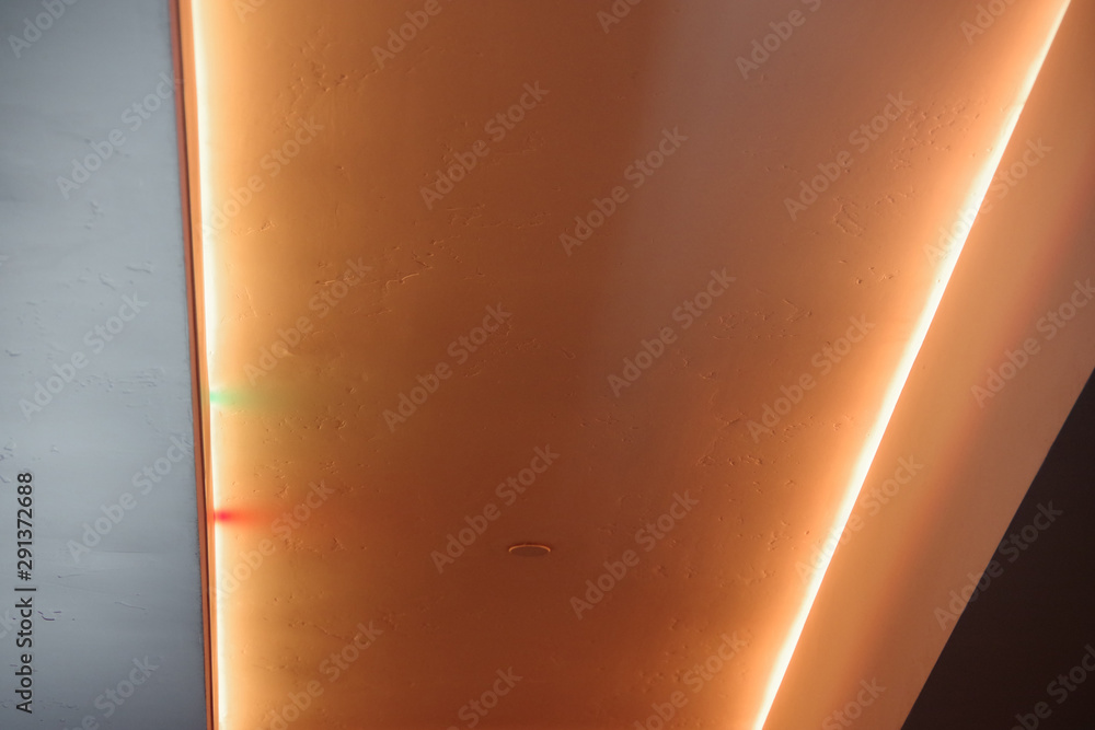 Close sectional upwards view of an illuminated hallway ceiling with ...