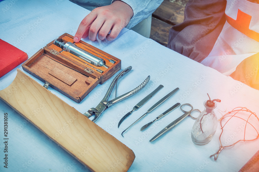 Medical instruments in the field military hospital. Syringe, clamp ...