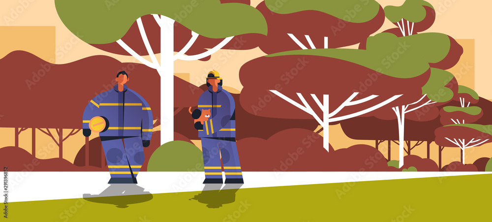 brave firemen rescuing cat firefighters couple wearing uniform and ...