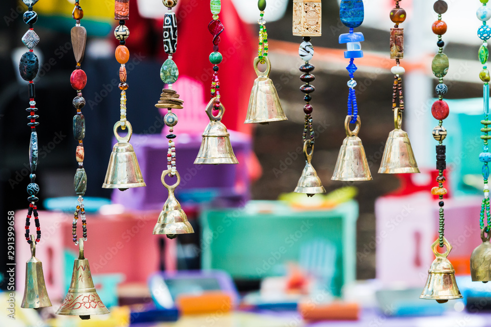 Abstract background of beads on a string with bells on the end of them ...