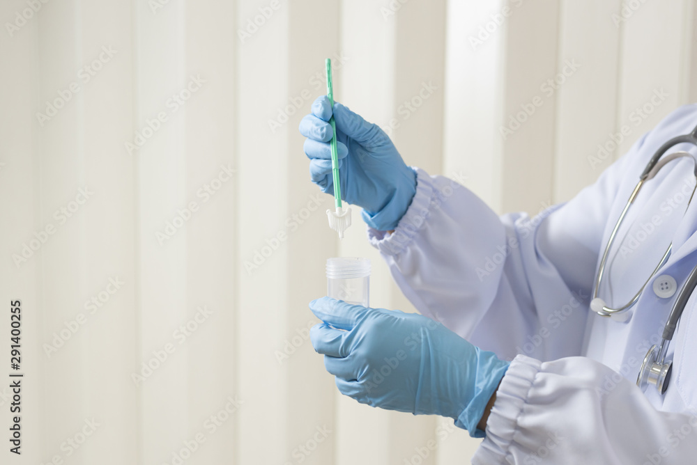 Doctor hand holding liquid base cytology set on blue background ...