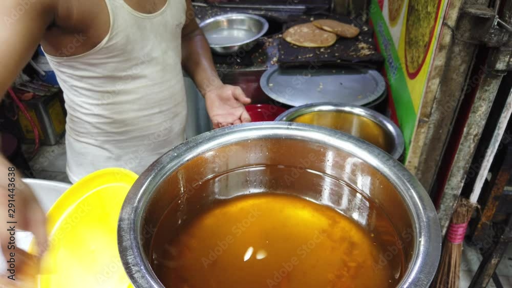 Street vendor selling almond topped Shahi Sheermal or Shirmal, is a ...