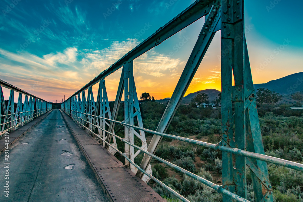 Sunset at the historic Lady de Waal bridge outside Steytlerville in the ...
