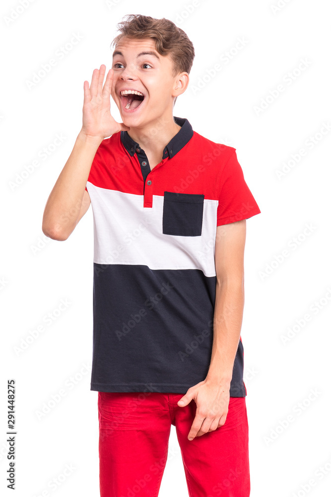 Attention! Portrait of teen boy is holding hand near his open mouth and ...