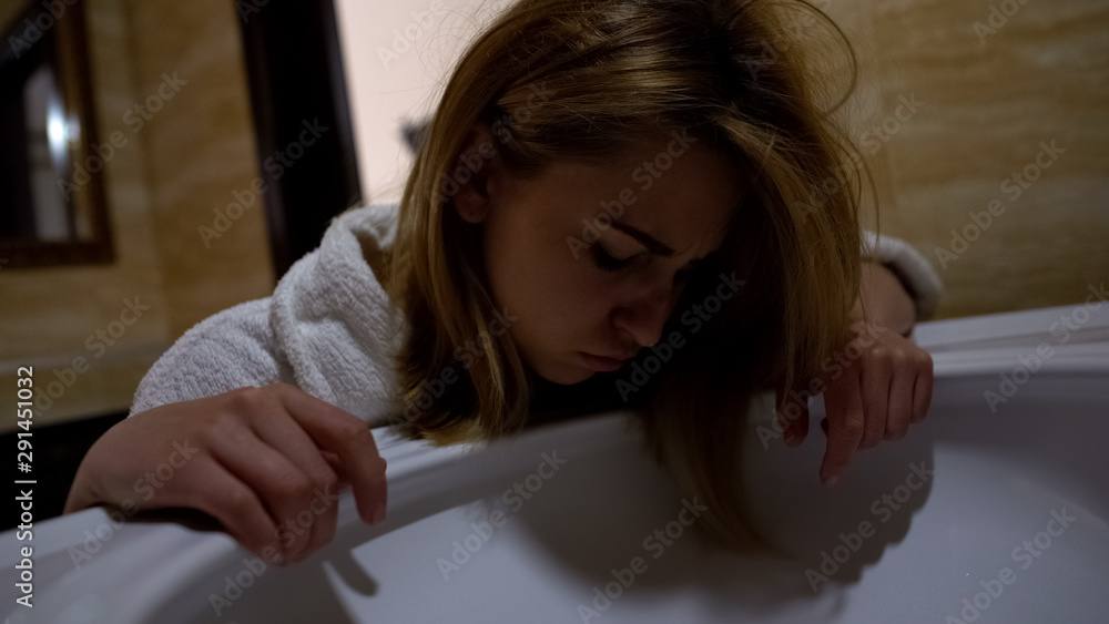 Female in bath robe vomiting at home, pregnancy symptom, toxicosis ...