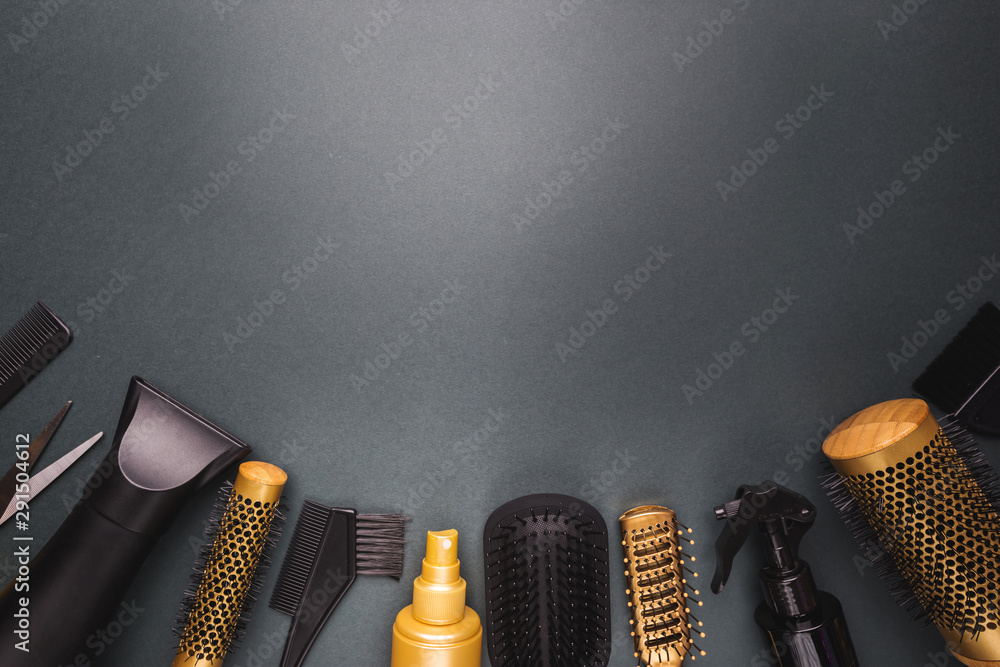 Various hair dresser and cut tools on black background with copy space ...