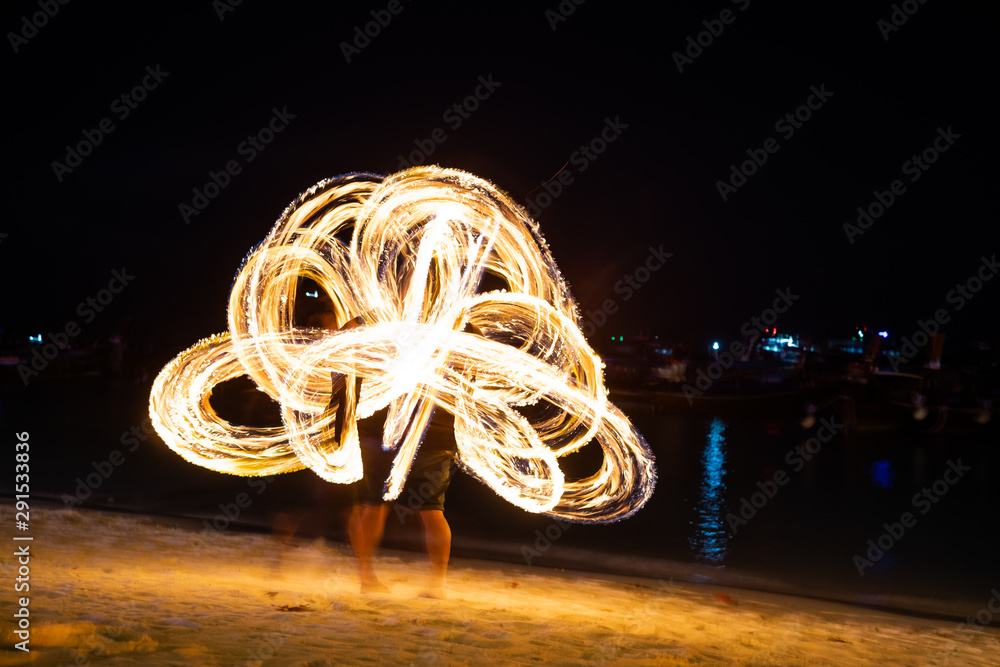 Amazing fire dancers Swing fire dancing show fire show on the beach in ...