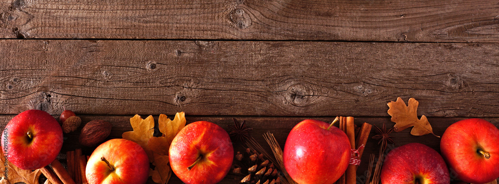Autumn long border banner of apples and fall ingredients on a rustic ...