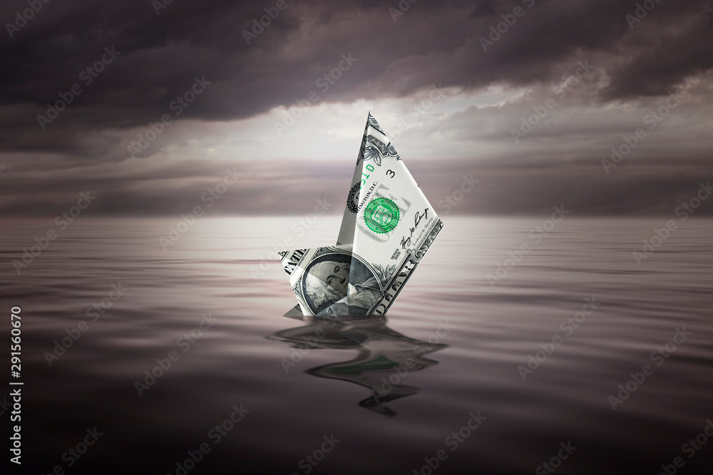 Sinking a little boat made with a dollar bill Stock Photo | Adobe Stock