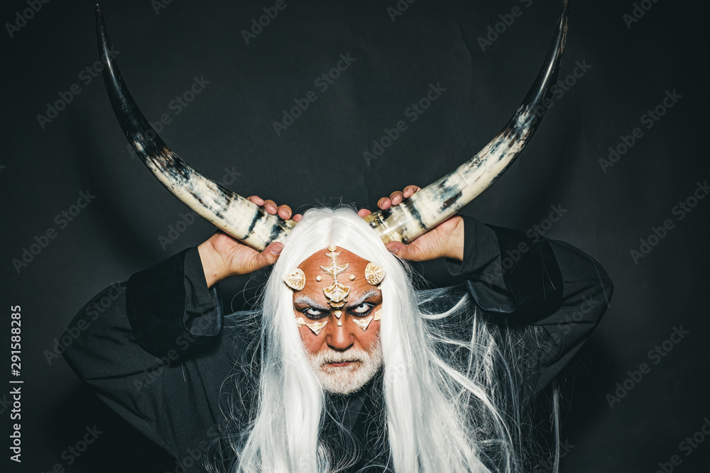 Magic and fairy tale concept. Man evil with horns. Monster with sharp ...