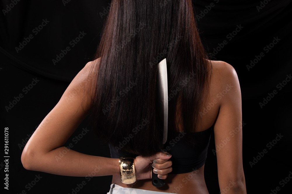 Back side view of Asian Woman long hair hold Kitchen sharp Knife in ...