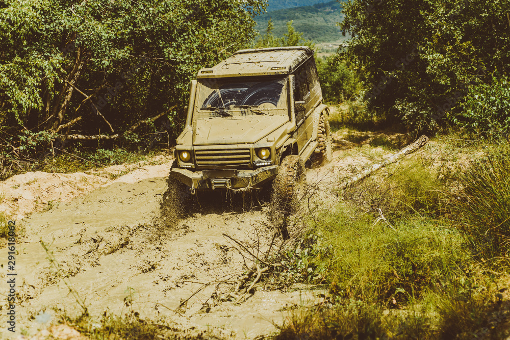 Off-road travel on mountain road. Drag racing car burns rubber. Extreme ...