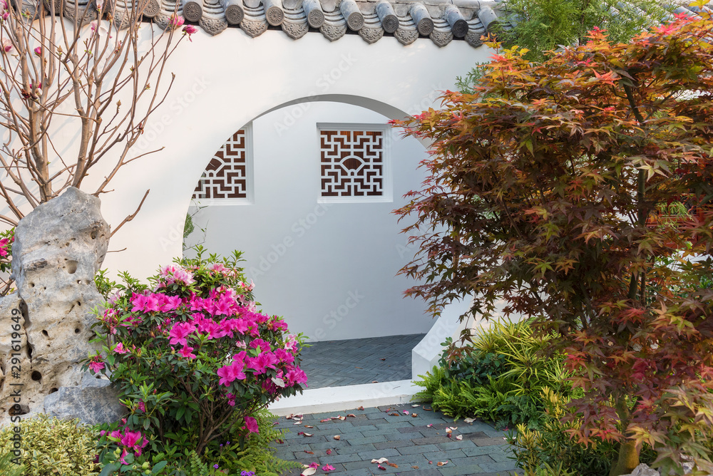 A Moon Gate is a circular opening in a garden wall that acts as a ...