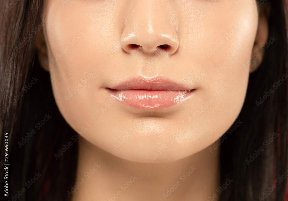 Beautiful young woman's full lips close-up shot. Female model with well ...