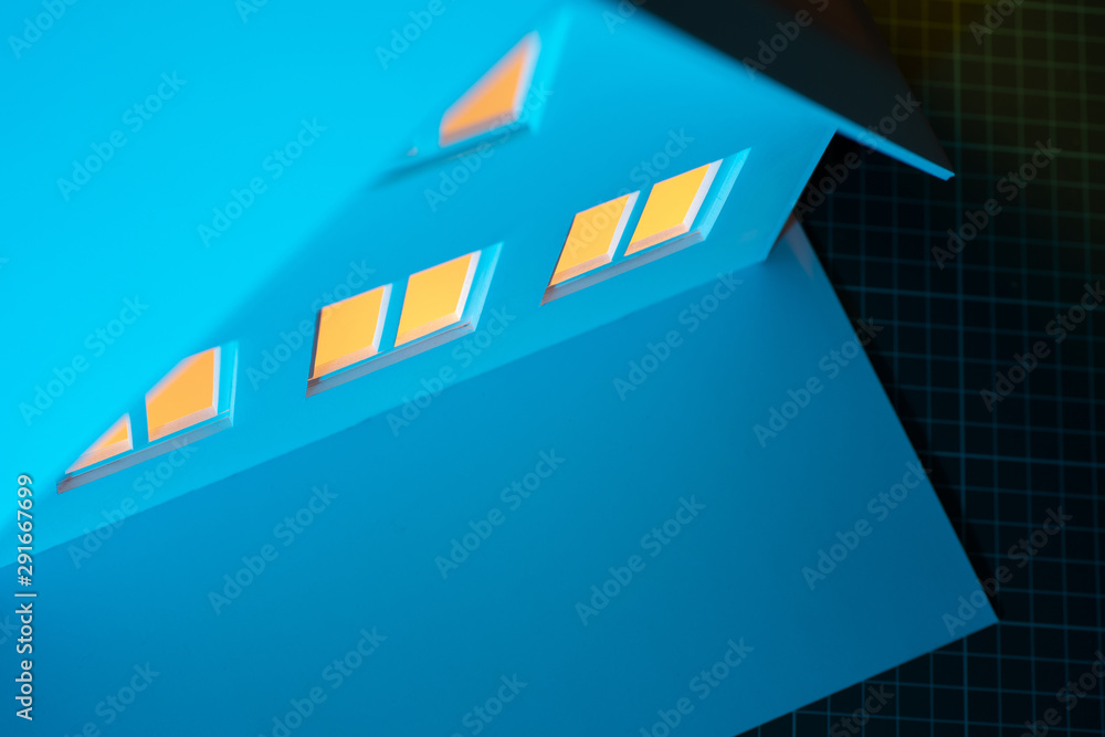 Concept - electric building. In the night building the light is on ...