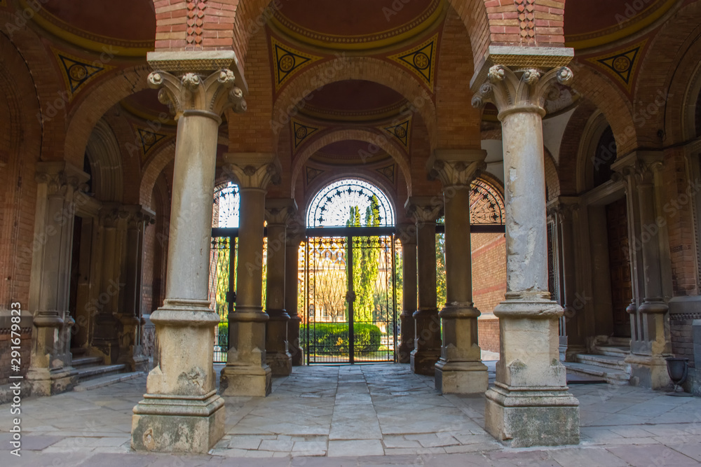 Colonnade portal with a domed ceiling and a cement stone columns with ...