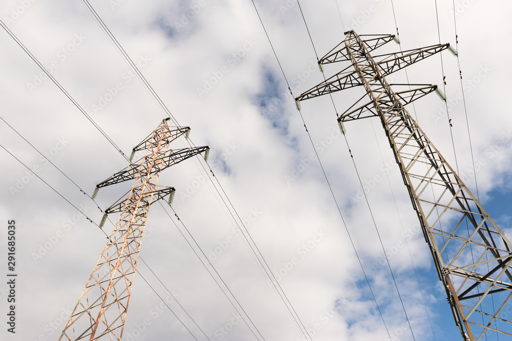 High-voltage technological power lines on metal poles with powerful ...