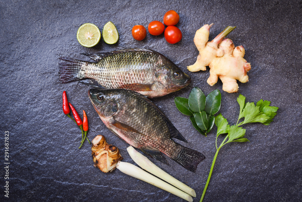 Tilapia fish freshwater and lime herb vegetable for cooking food in the ...