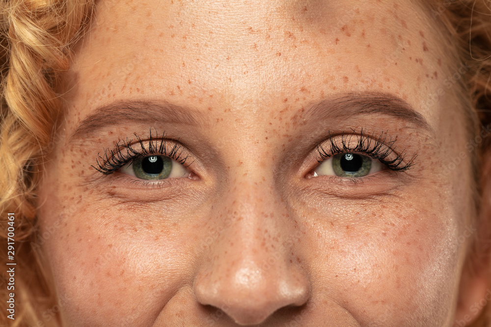Beautiful young woman's eyes close-up shot. Female model with well-kept ...