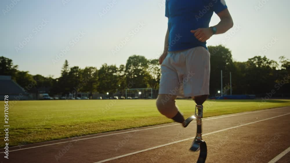 Athletic Disabled Fit Man with Prosthetic Running Blades is Training on ...
