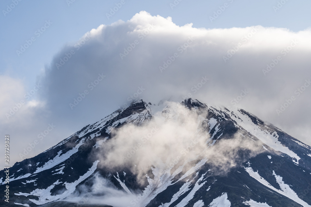 Beautiful autumn volcanic landscape - view of snow-capped cone of ...