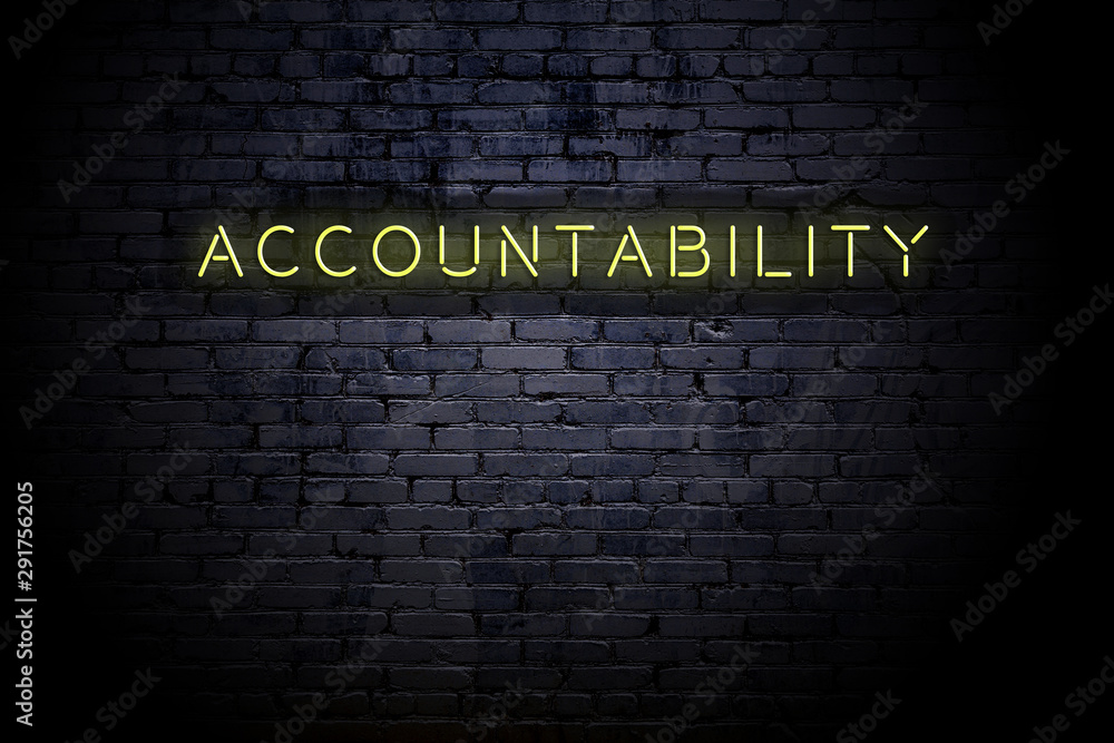 Highlighted brick wall with neon inscription accountability Stock ...