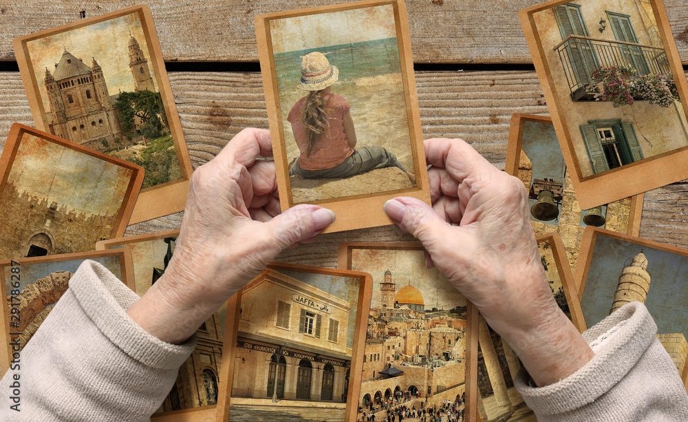 Old female hands hold old photo. Vintage photo cards background ...