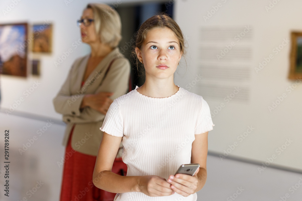 Teenage girl visiting museum Stock Photo | Adobe Stock