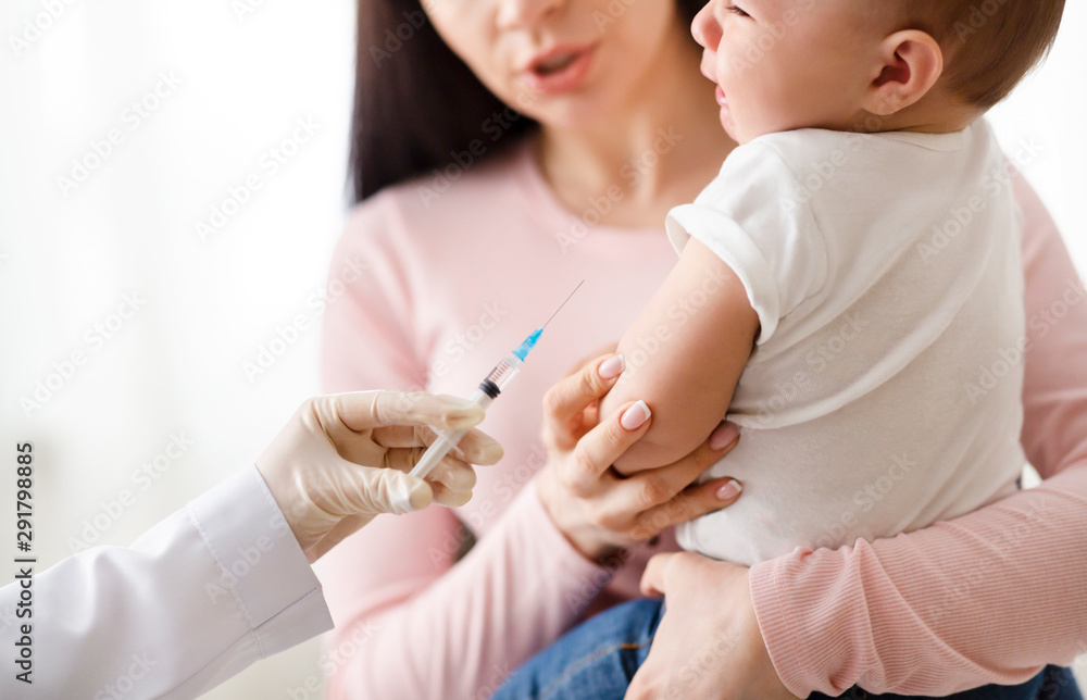 Doctor giving intramuscular injection to little baby Stock Photo ...