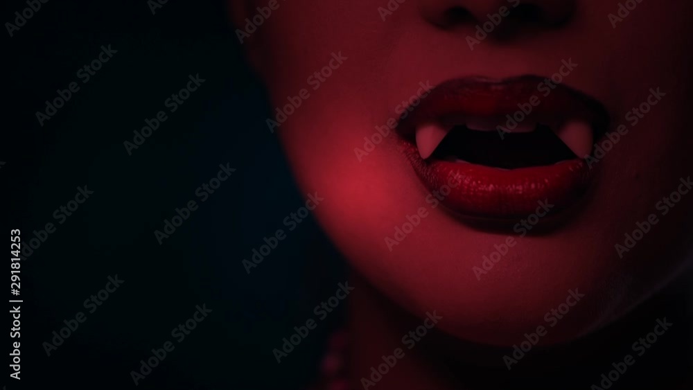 Sexy Vampire Woman's red bloody lips close-up. Vampire girl licking ...