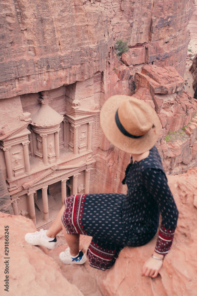 Tourist exploring Jordanian ancient city Petra Stock Photo | Adobe Stock