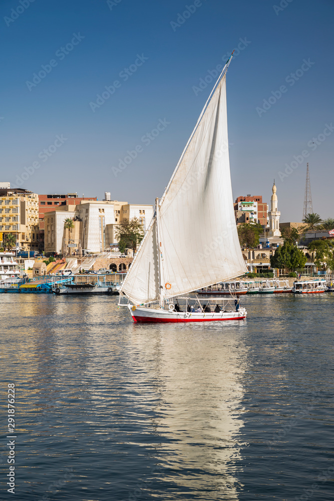 Felucca boat crossing the Nile River near the Elephantine Island of ...