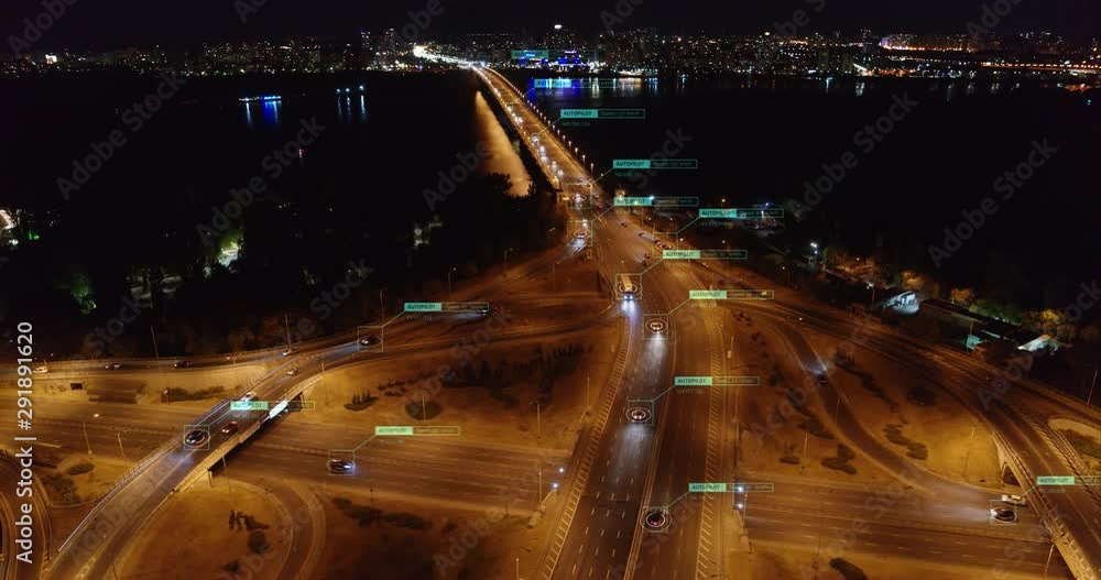 Self autonomous unmanned Cars driving on night crossroads Aerial view ...