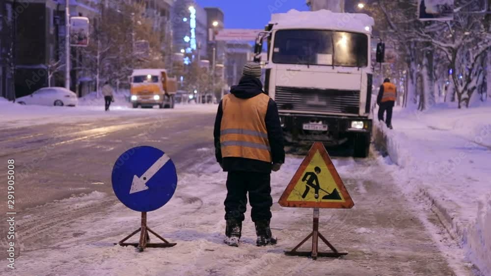 Snowblower clear freezing winter road with snow and ice. Snow-plow ...