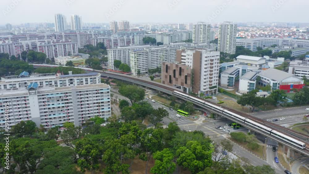 An aerial 4k drone footage of The Mass Rapid Transit (MRT) moving train ...