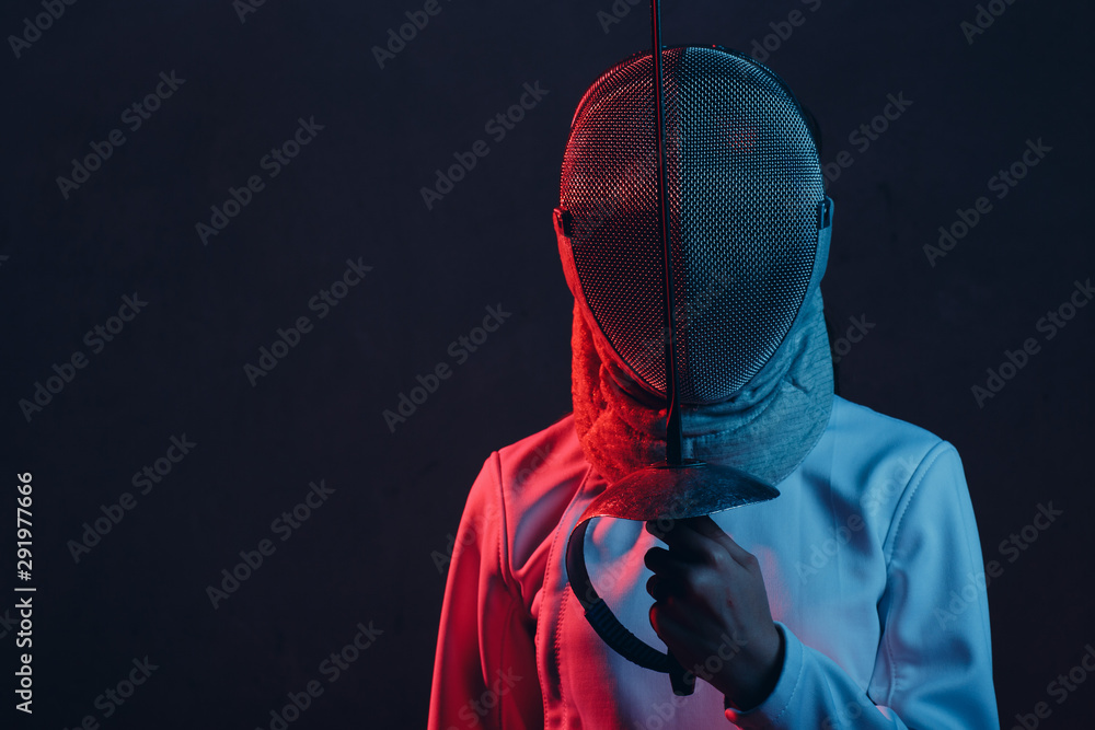 Fencer woman in mask profile portrait with fencing sword, rapier, epee ...