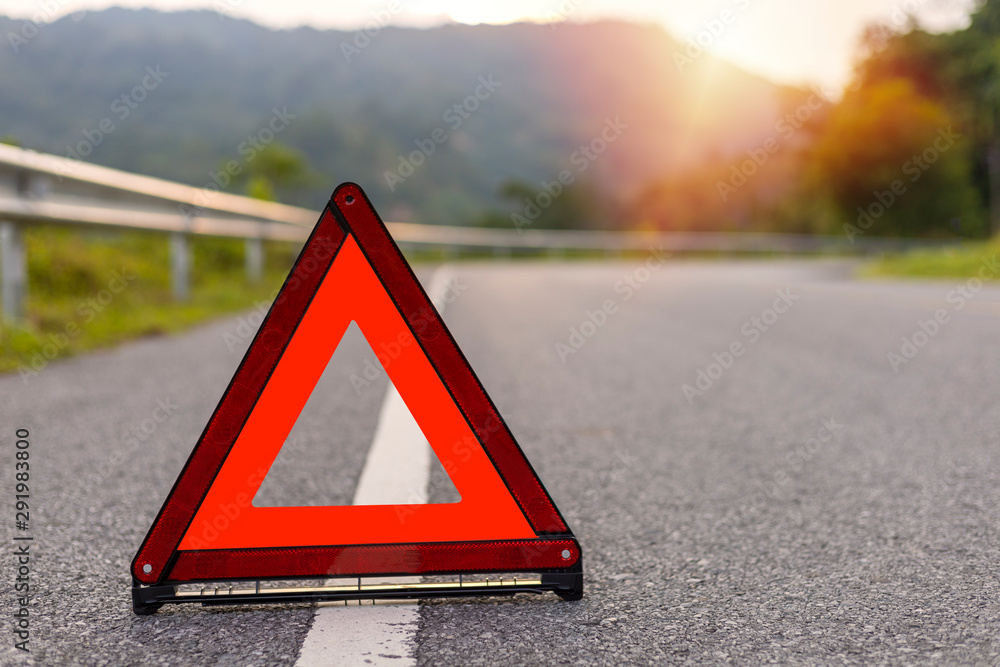 Red triangle, red emergency stop sign, red emergency symbol on road ...