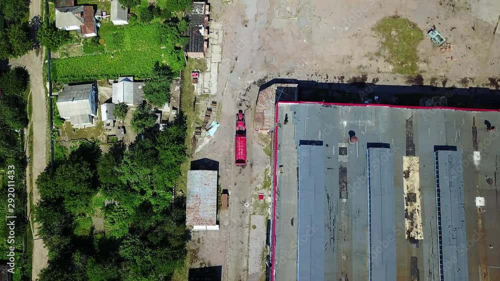 top view of tractor is moving in from the factory, aerial view of ...
