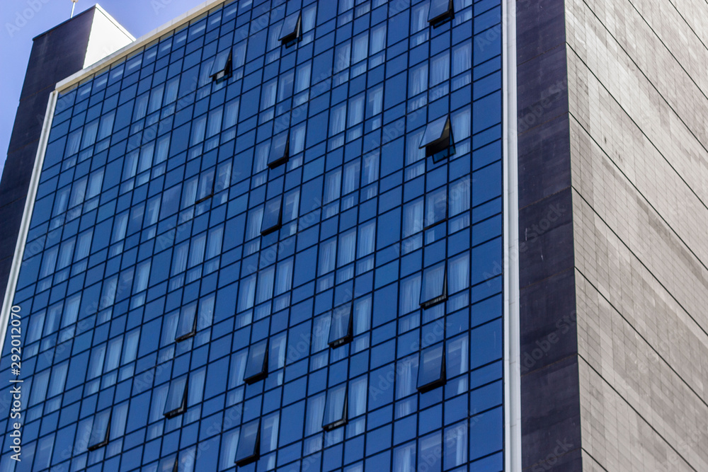 Perspective shoot of high-rise glazing facade office building structure ...
