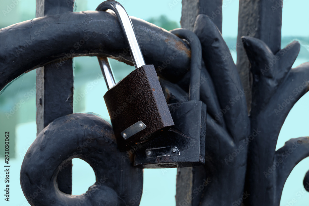 Locks symbol of indestructible love on a cast-iron grate. Stock Photo ...