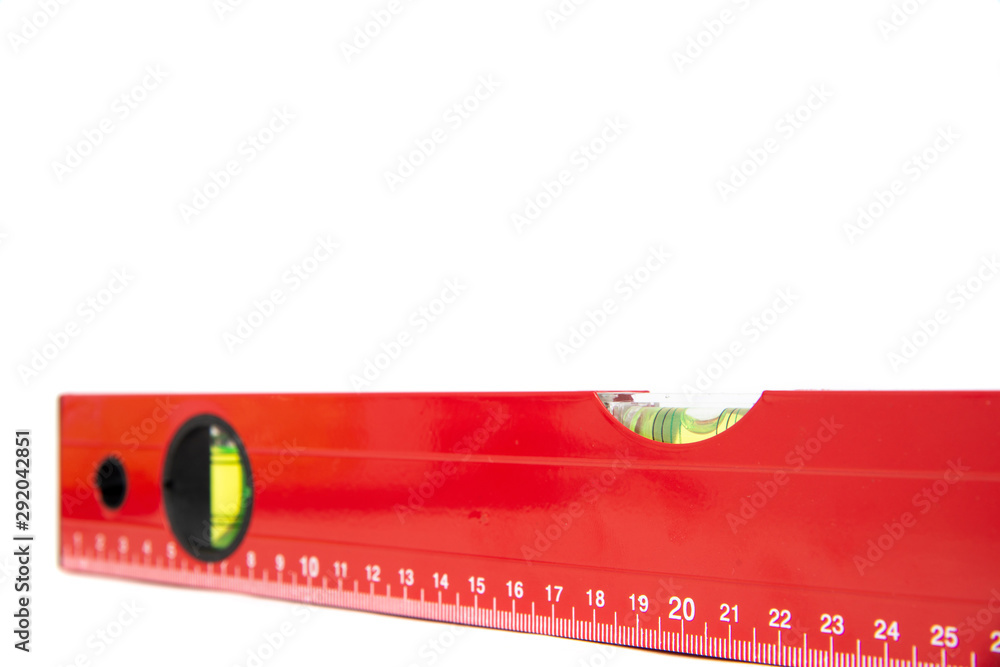 Red spirit level isolated on a white background. The concept of ...