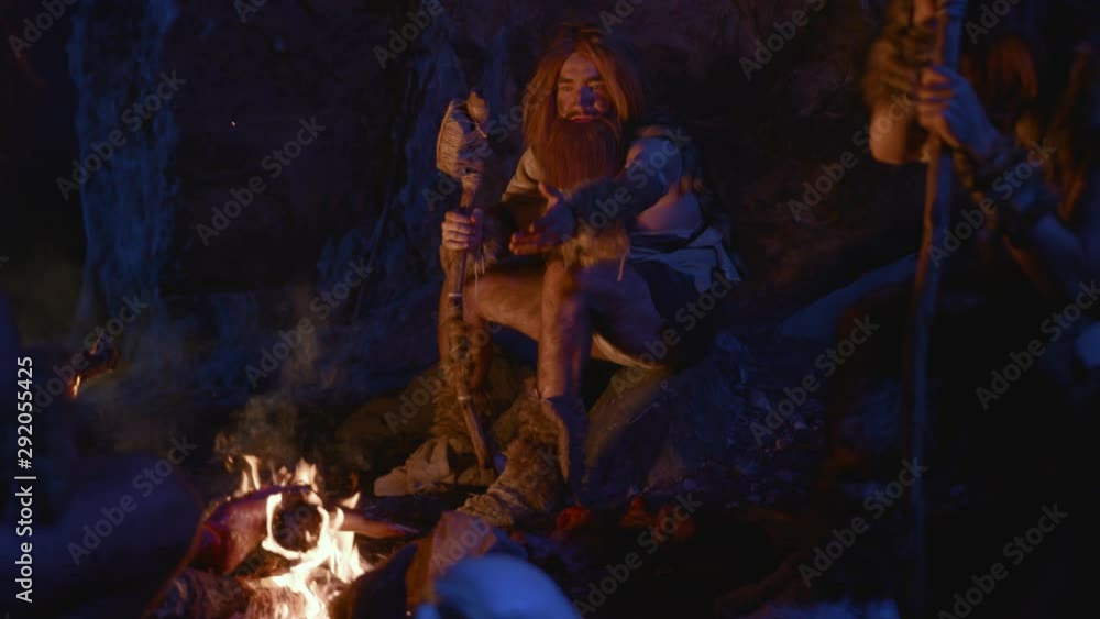 Primal tribe of ancient wild people animal skin and stone axes eating ...