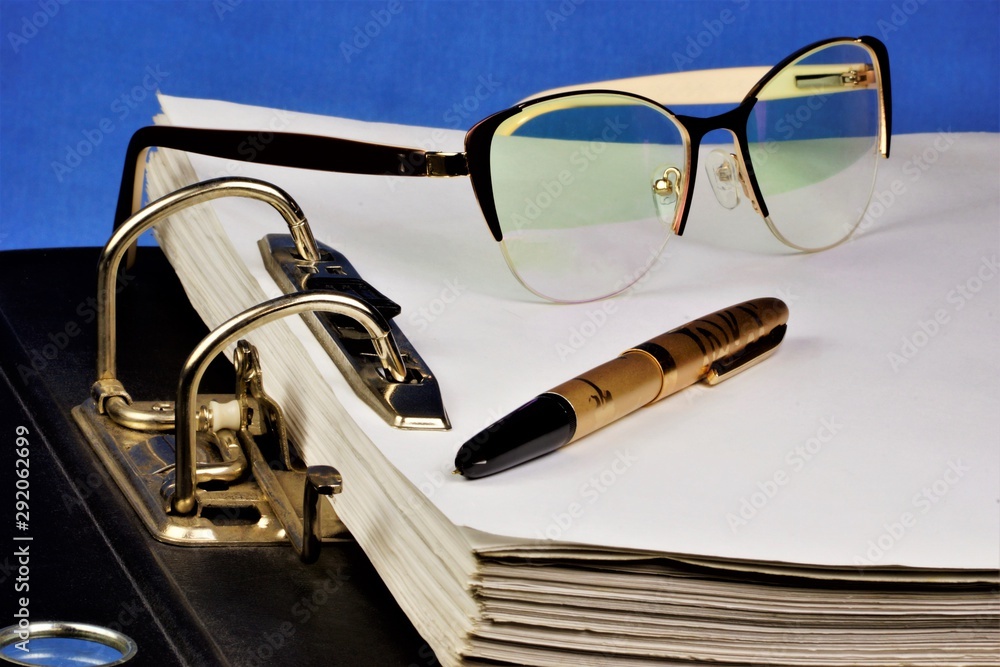 Folder with files-Registrar of archival records, glasses, pen.Folder ...