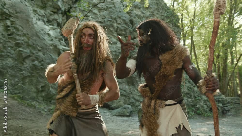 Aboriginal wild caveman of prehistoric period hunting for animal food ...