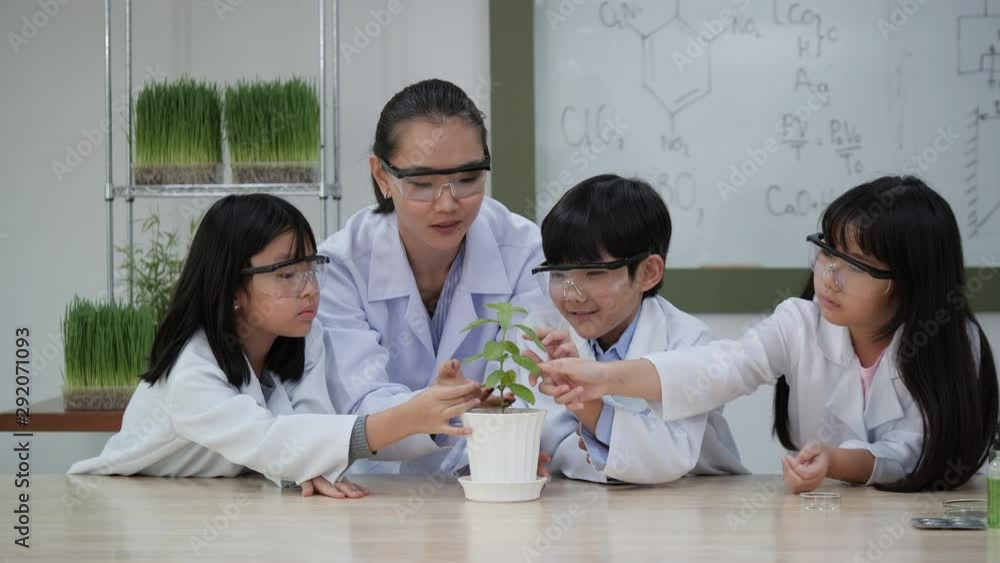 Asian teacher teaching agricultural to children in the classroom at ...