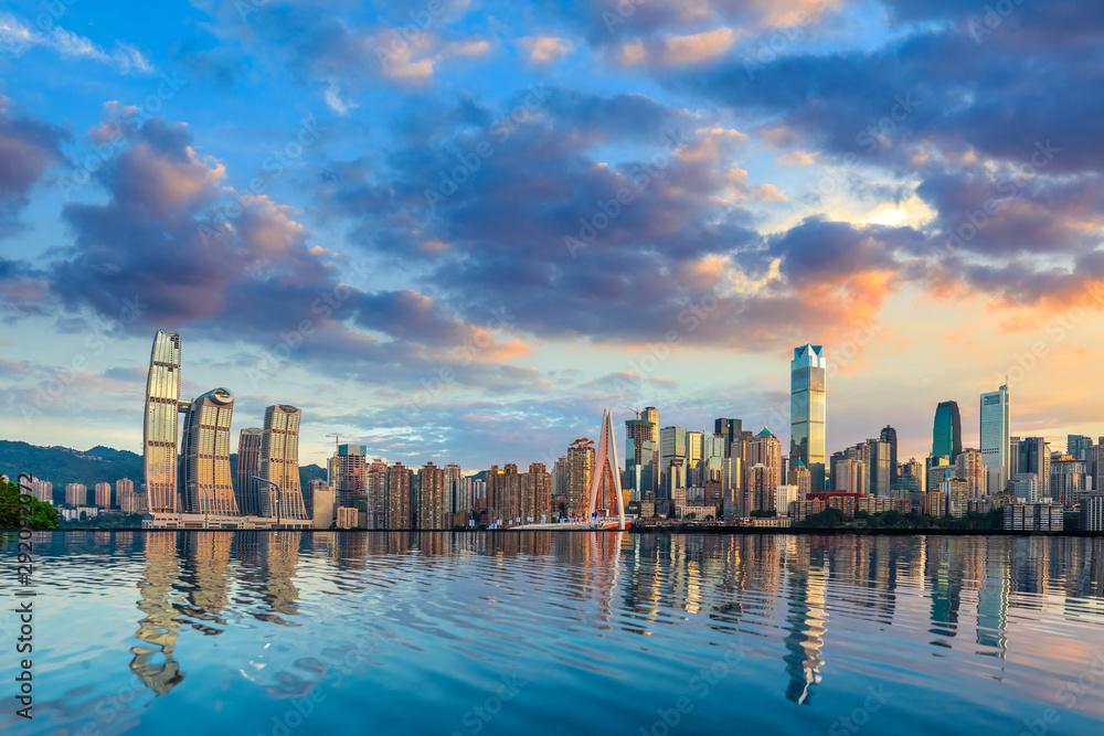 Chongqing skyline and modern urban skyscrapers with water reflection at ...