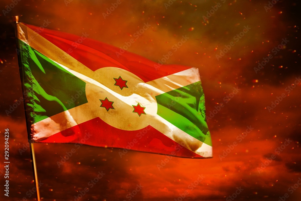 Fluttering Burundi flag on crimson red sky with smoke pillars ...