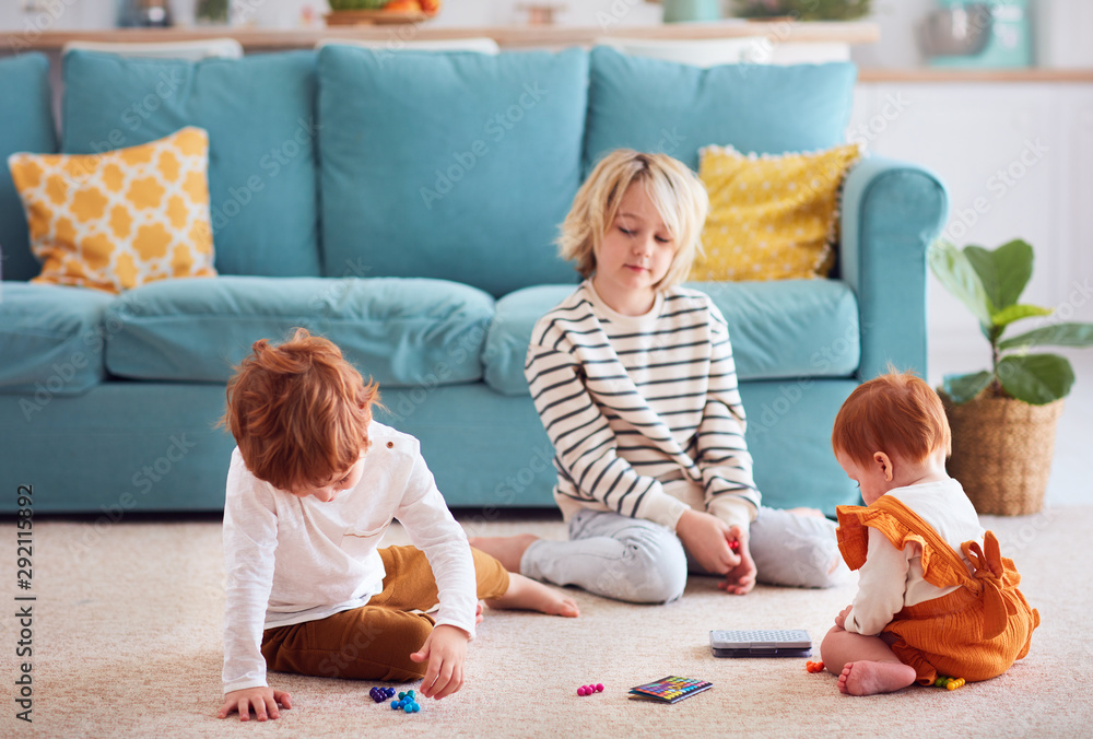 cute kids, siblings playing on the floor at home Stock Photo | Adobe Stock