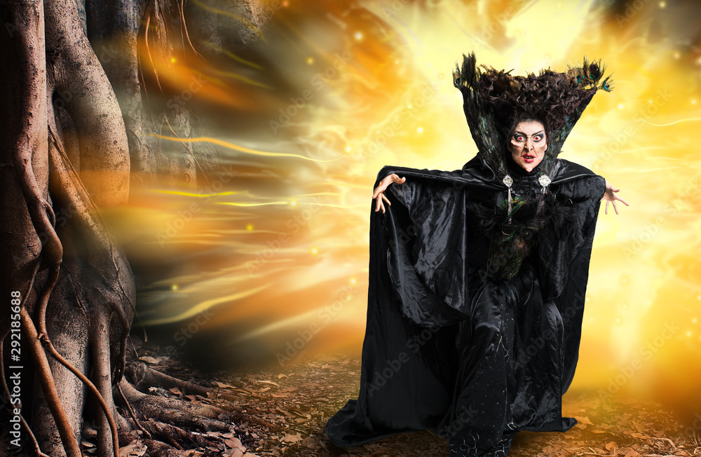 Scary witch conjuring a spell in the woods Stock Photo | Adobe Stock