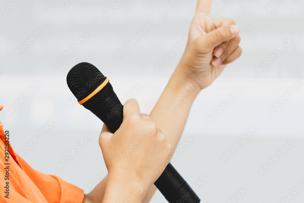 Rear side of Smart businesswoman speech and speaking with microphone ...